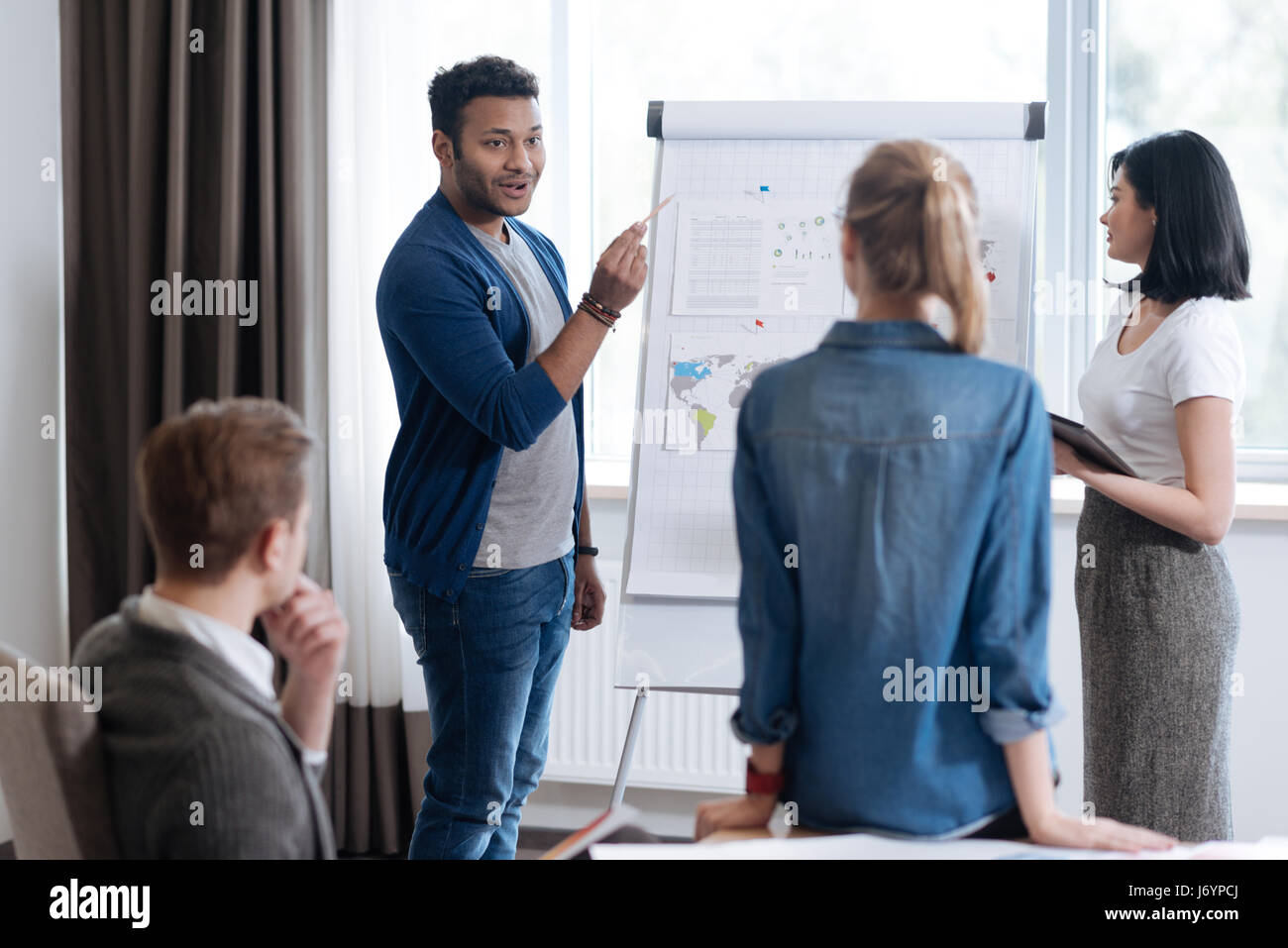 Nice hard working man presenting his report Stock Photo - Alamy
