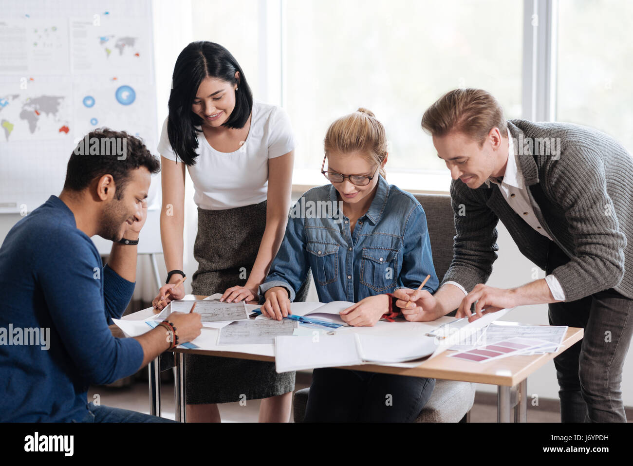 Positive nice colleagues working together Stock Photo - Alamy