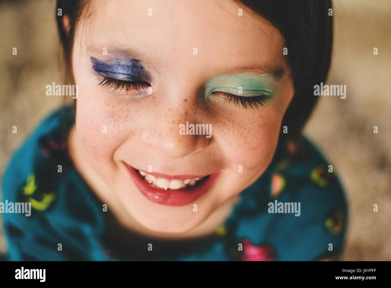 Portrait of a smiling girl wearing eye shadow Stock Photo - Alamy