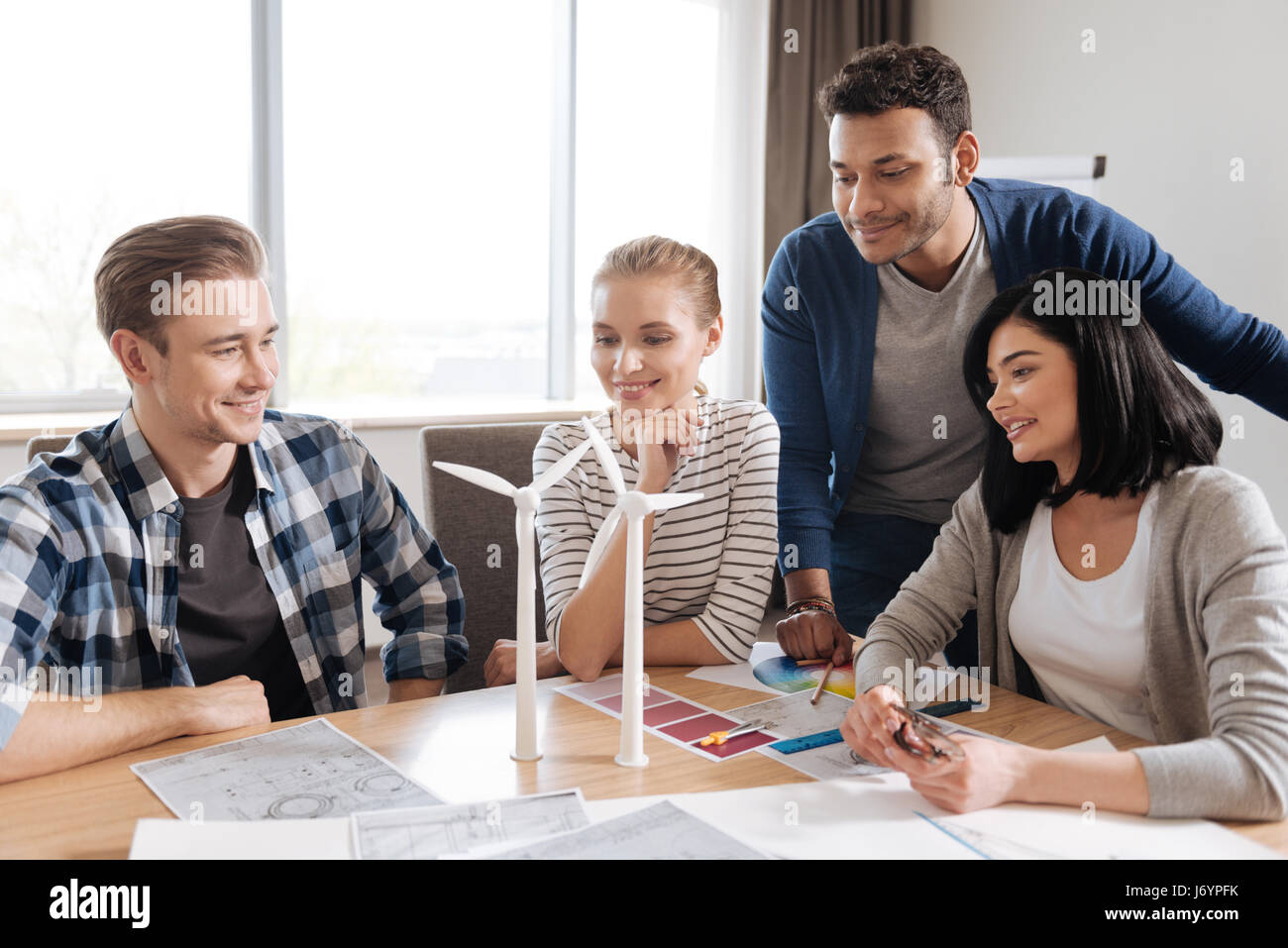 Positive nice team of engineers trying to save the energy Stock Photo ...