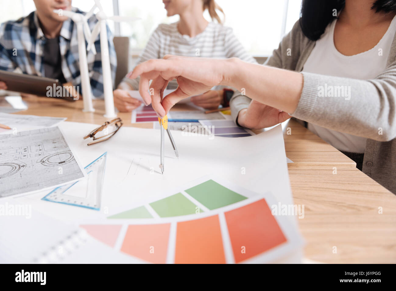 Pair of compasses being used by a female engineer Stock Photo - Alamy