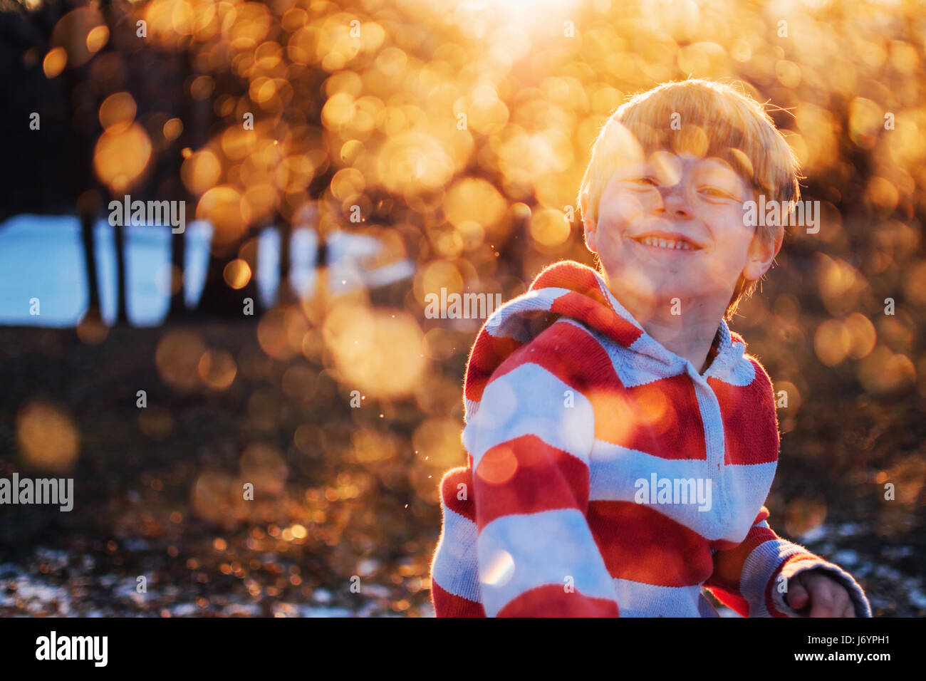 Portrait of a smiling boy in the forest Stock Photo - Alamy