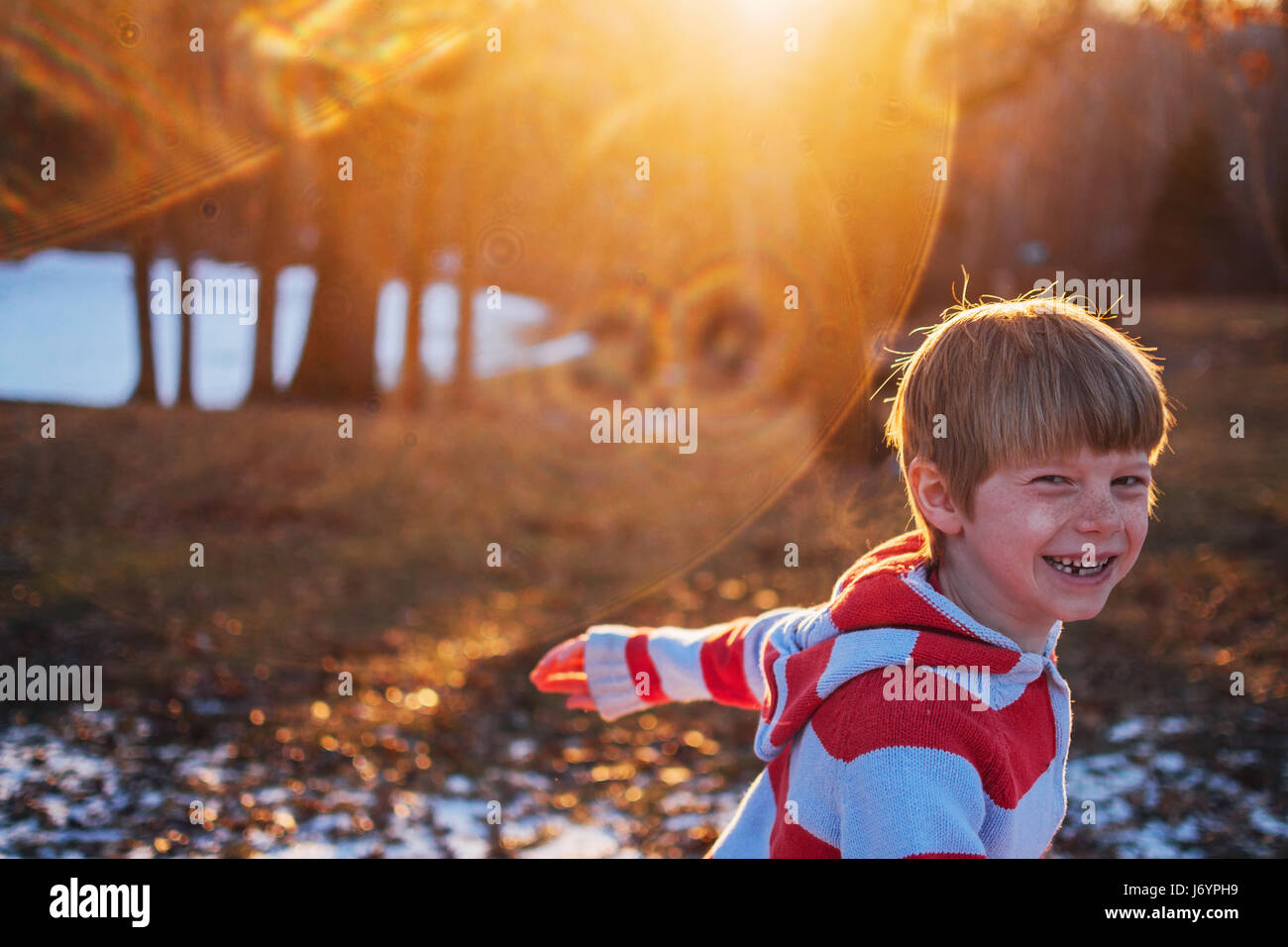 Portrait of a smiling boy in the forest Stock Photo - Alamy