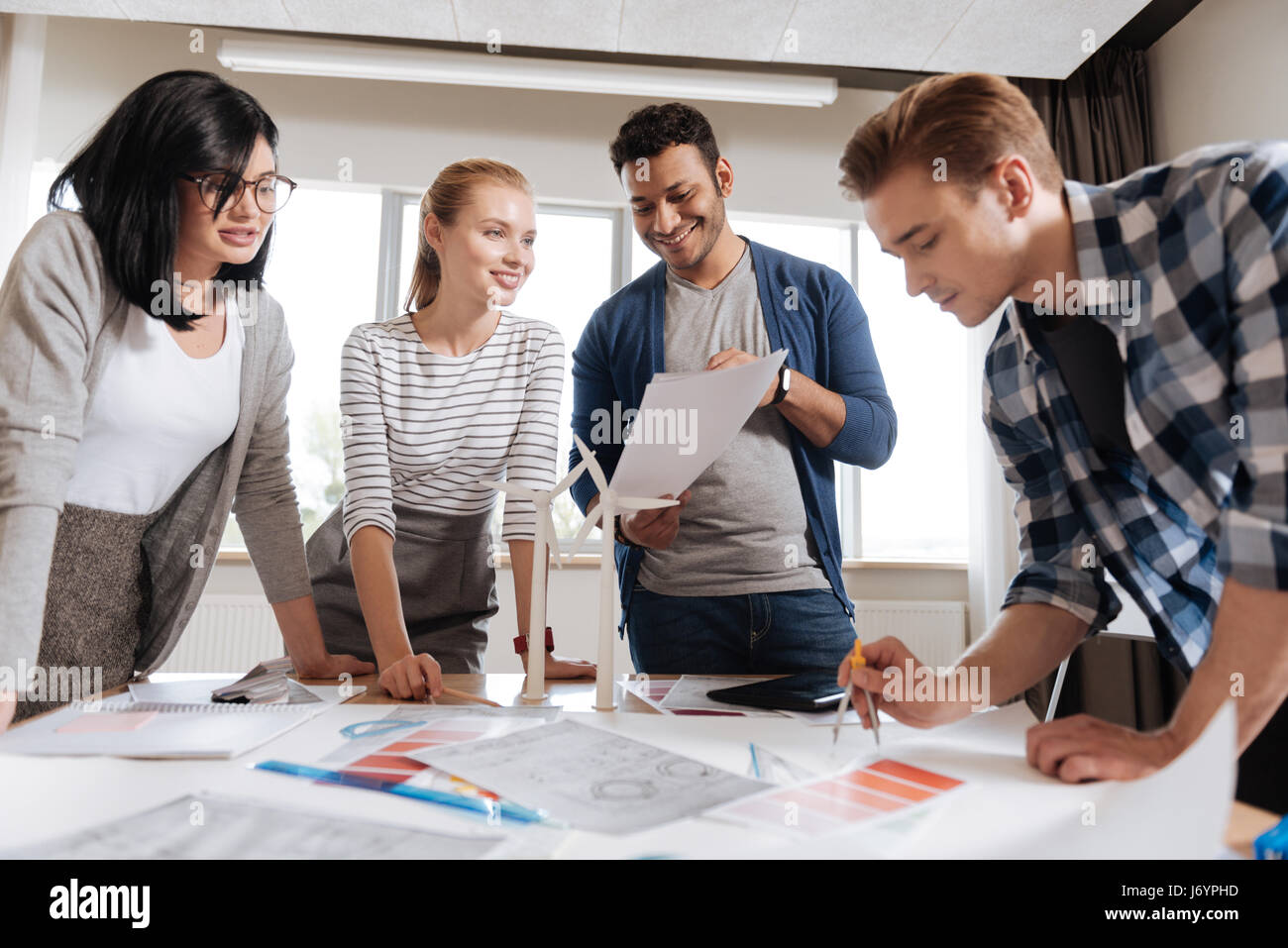 Pleasant nice team of engineers focusing in their work Stock Photo - Alamy