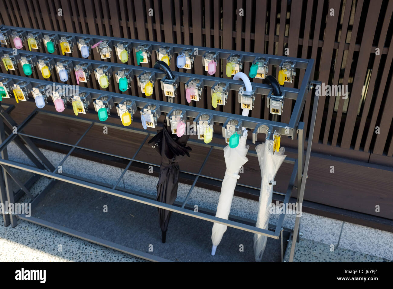 A rack outside a restaurant where you can lock your umbrella Stock ...