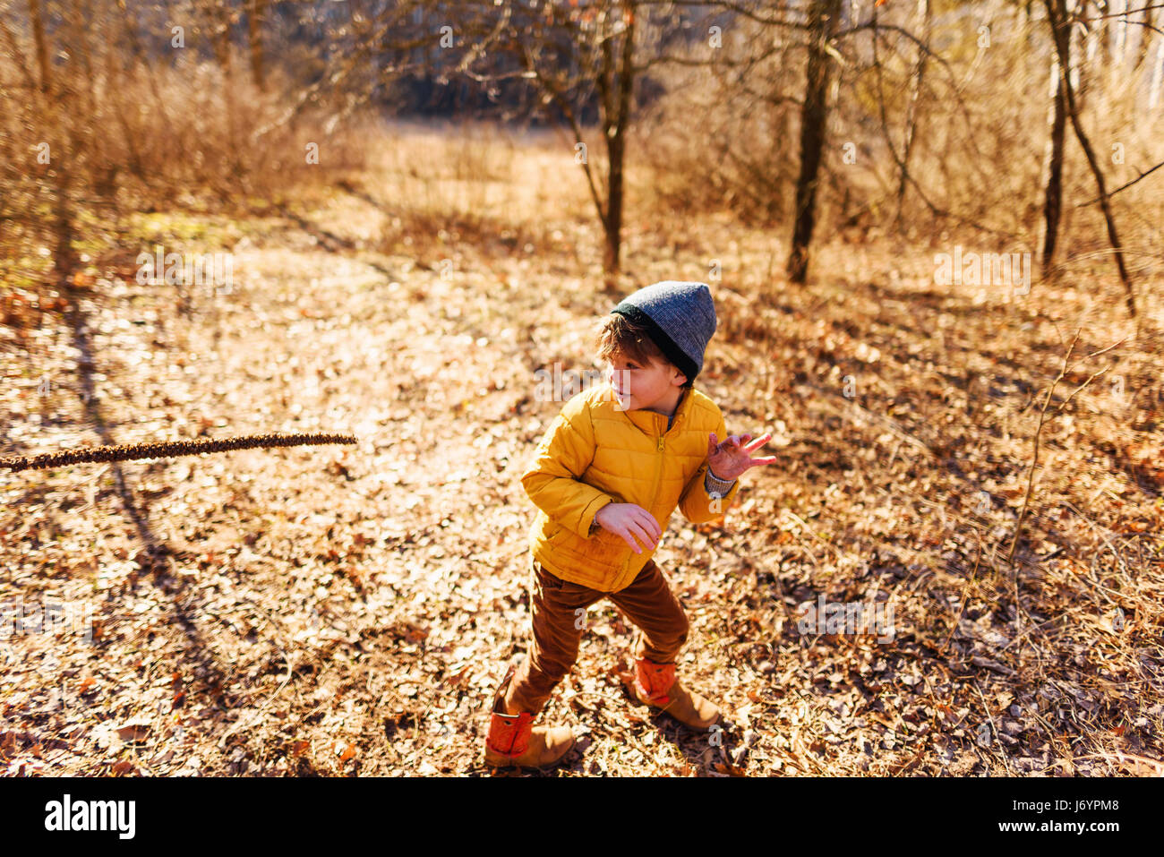 Boy playing with stick hi-res stock photography and images - Alamy