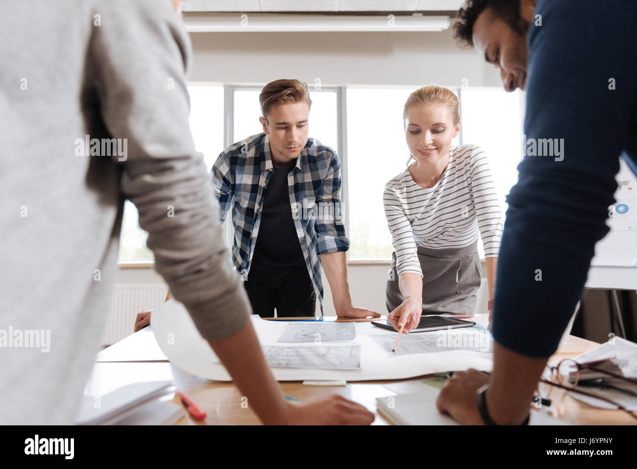 Nice professional engineers focusing on their project Stock Photo - Alamy