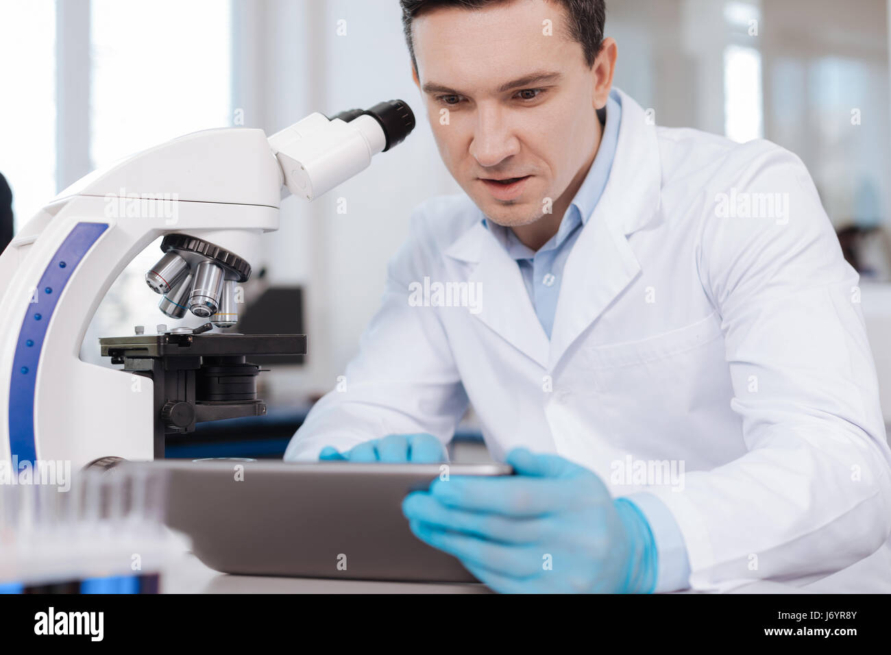 Positive male person being in the lab Stock Photo - Alamy