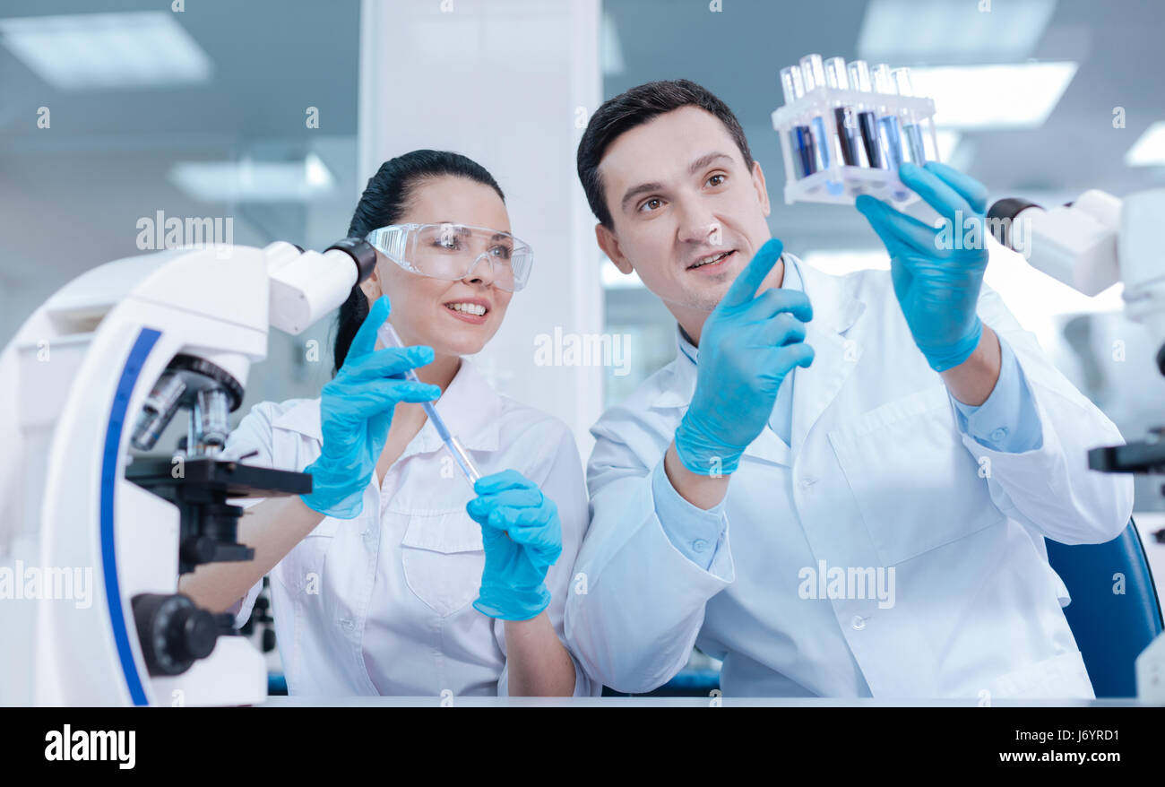 Two colleagues working together in the laboratory Stock Photo - Alamy
