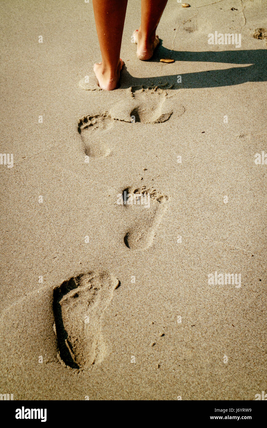 Walking Footprints In Sand