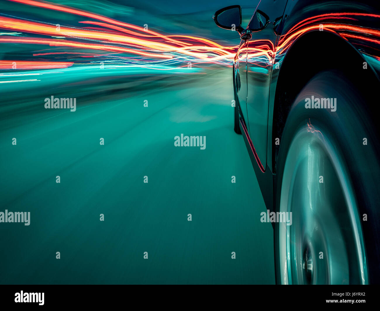 Car driving through traffic Stock Photo - Alamy