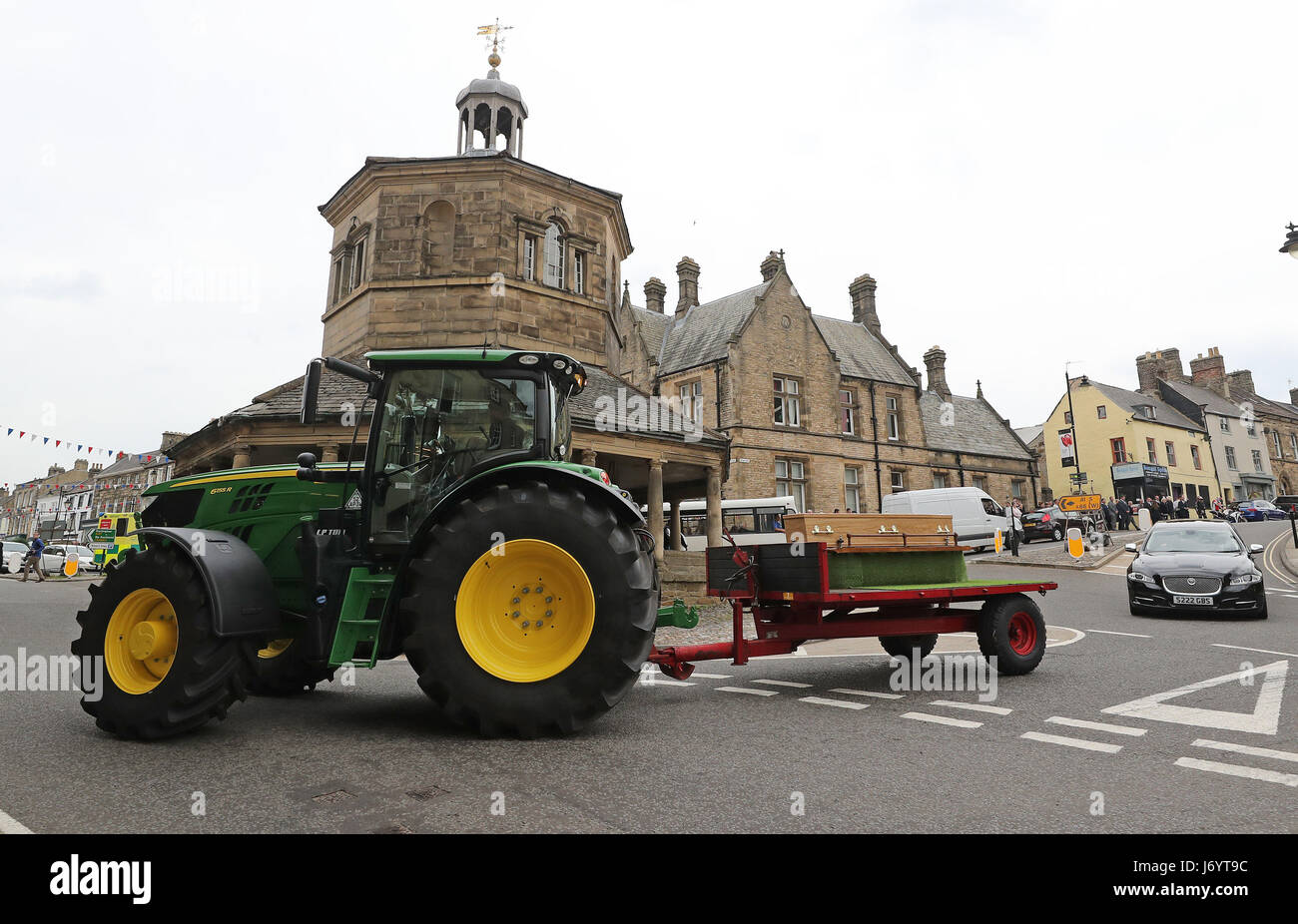 The funeral cortege made up of a tractor and bikers, for the funeral of ...
