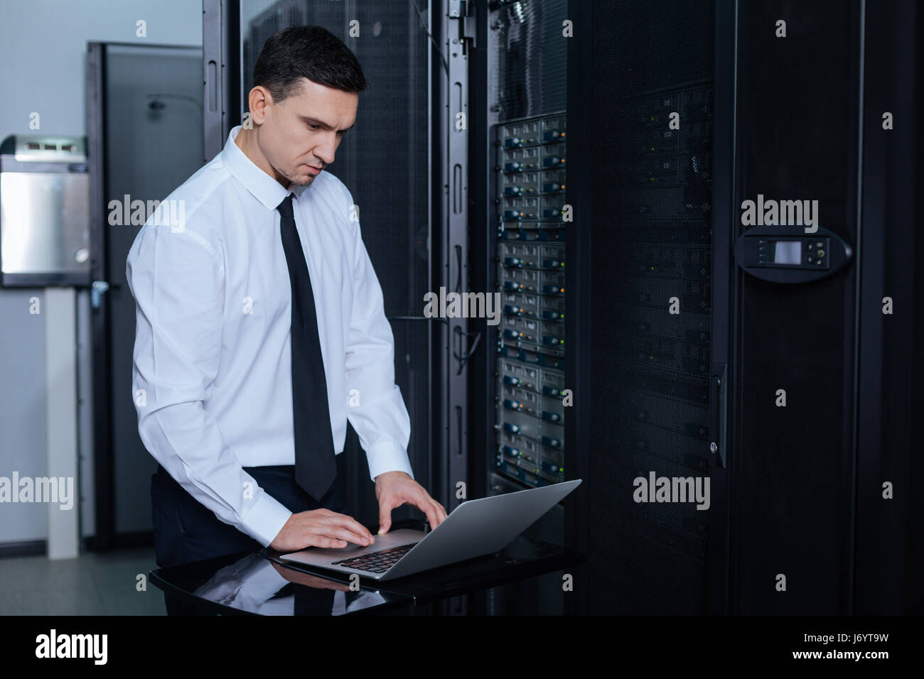 Database programmer typing server code hi-res stock photography and ...