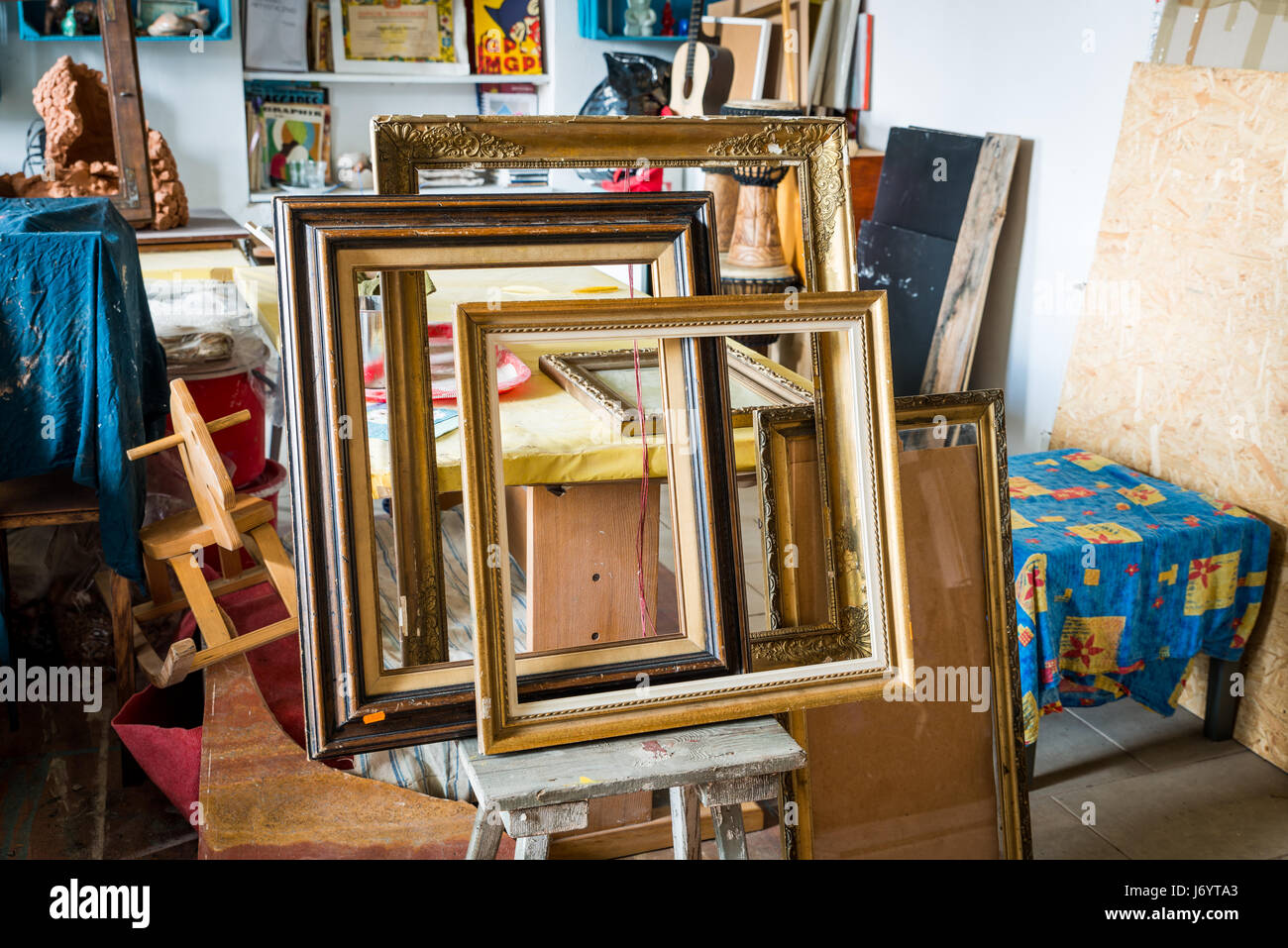 Old wooden painting frames in painter studio Stock Photo - Alamy