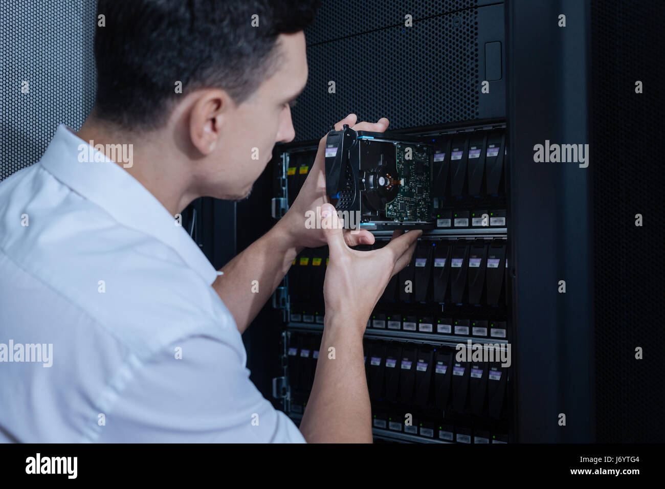 Male network engineer doing system hi-res stock photography and images ...
