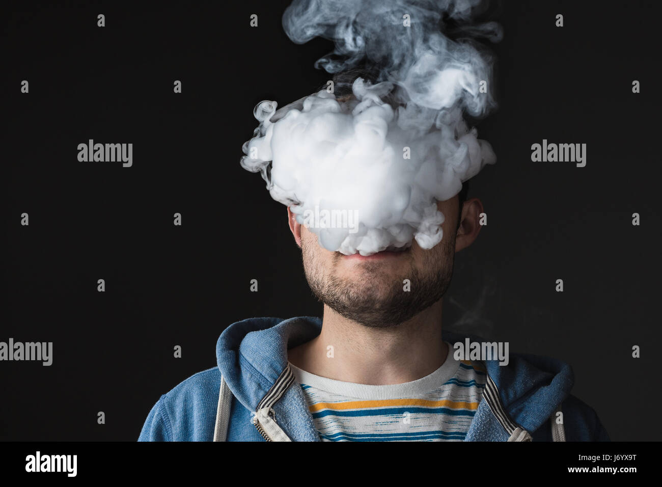 The face of vaping young man Stock Photo - Alamy
