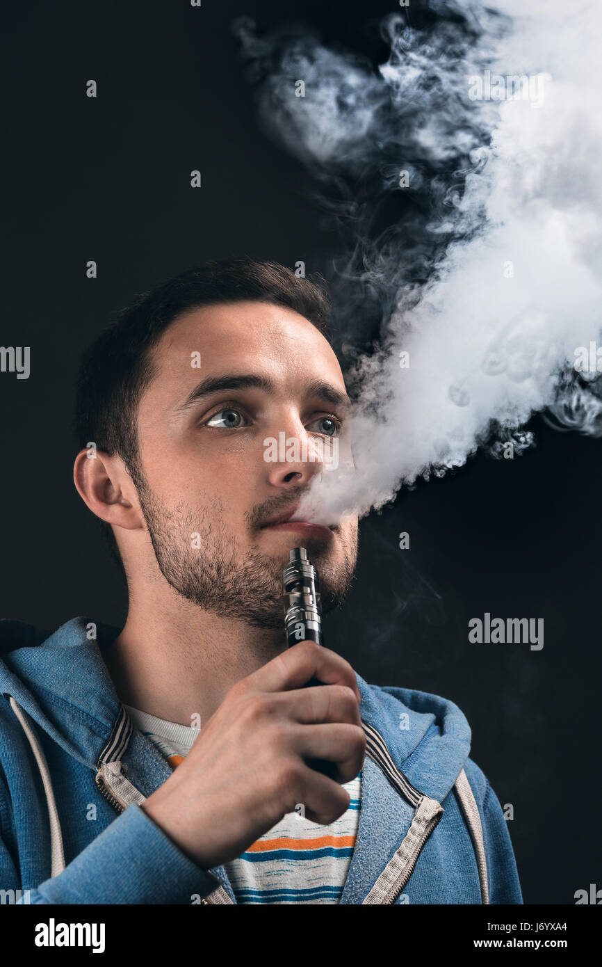 The face of vaping young man Stock Photo - Alamy