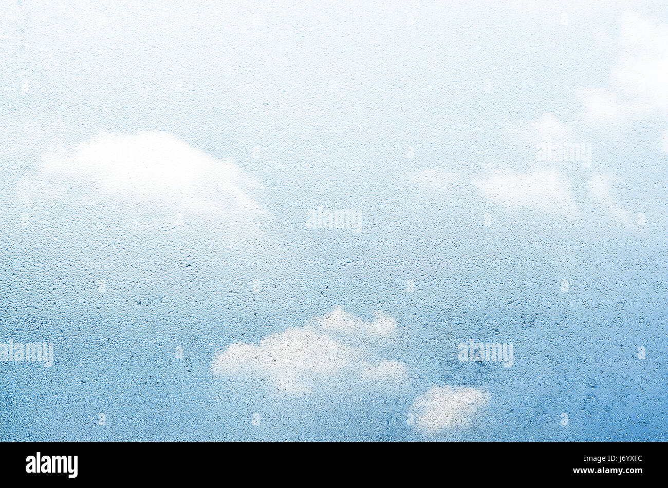 Water drops and sky through glass background. Condensation on the ...