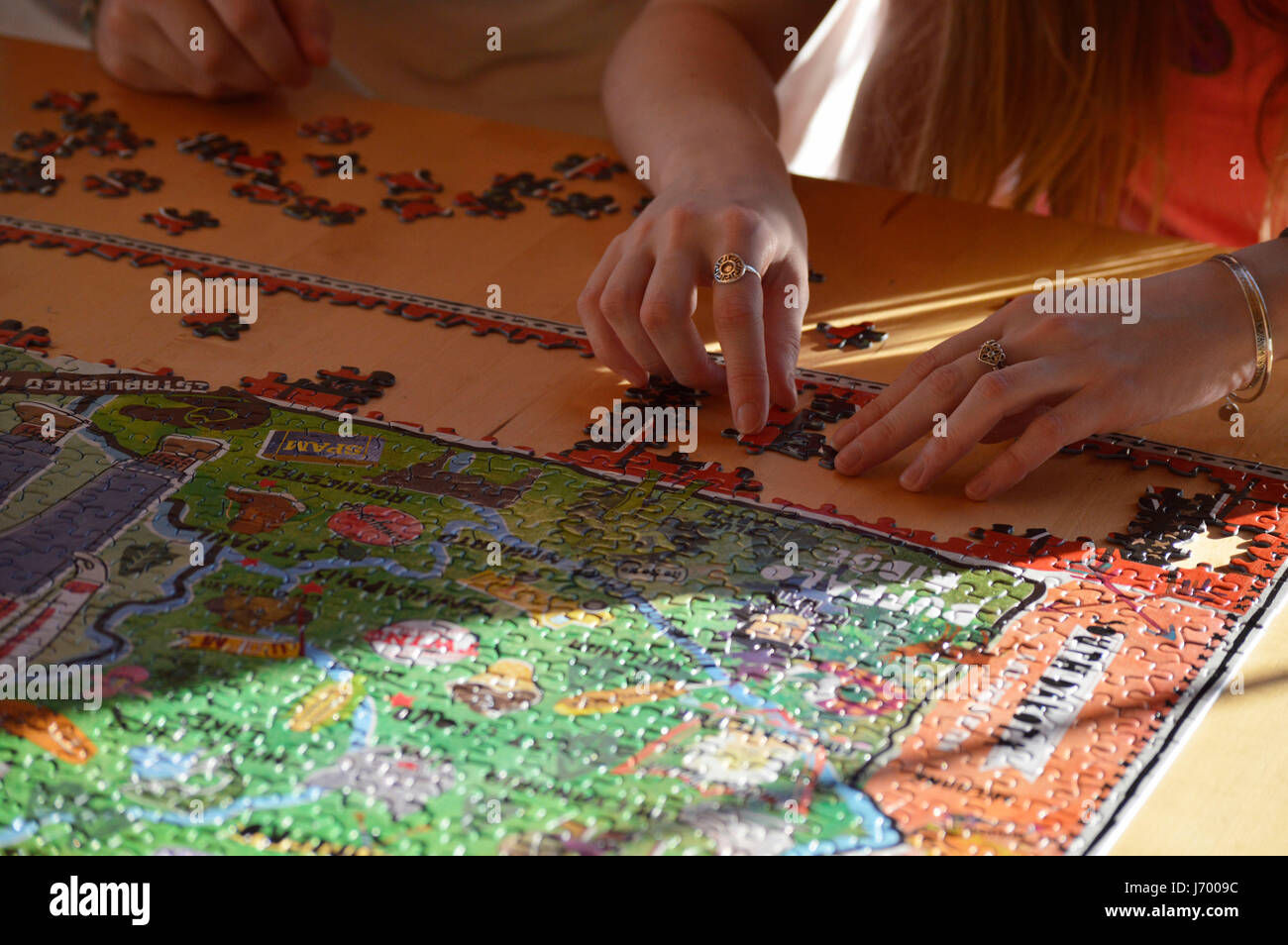 Working on puzzle hi-res stock photography and images - Alamy
