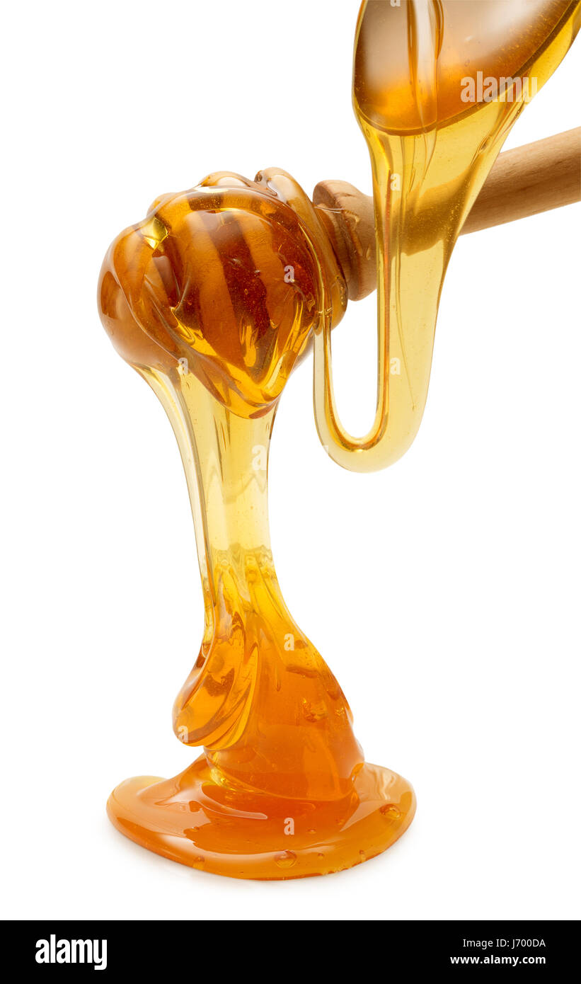 dropping honey isolated on a white background Stock Photo - Alamy