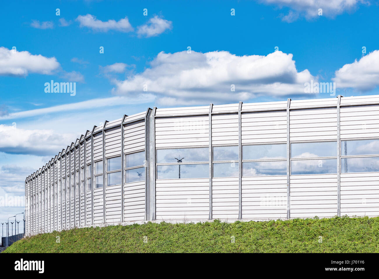 Noise protection fence along the new highway Stock Photo - Alamy