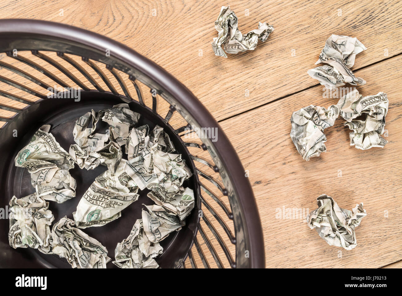 Crumpled money in trash Stock Photo - Alamy