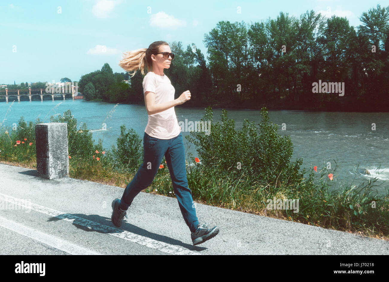 Woman run, running on the river, fitness Stock Photo - Alamy