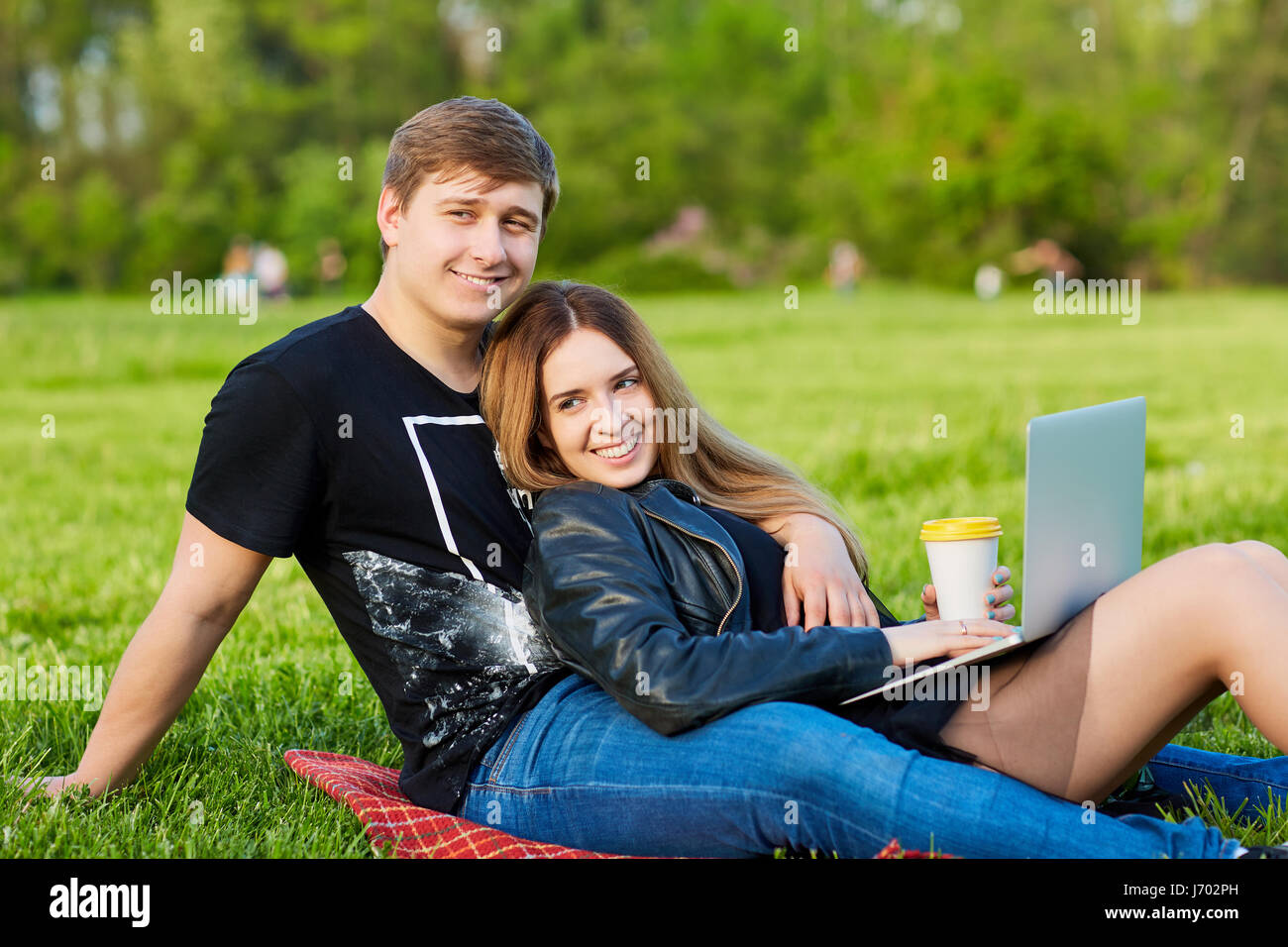 Couple hug laptop in hi-res stock photography and images - Alamy