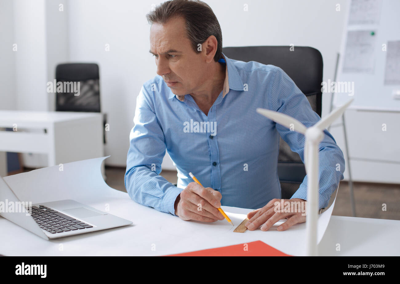 Professional engineer drawing blueprint Stock Photo - Alamy