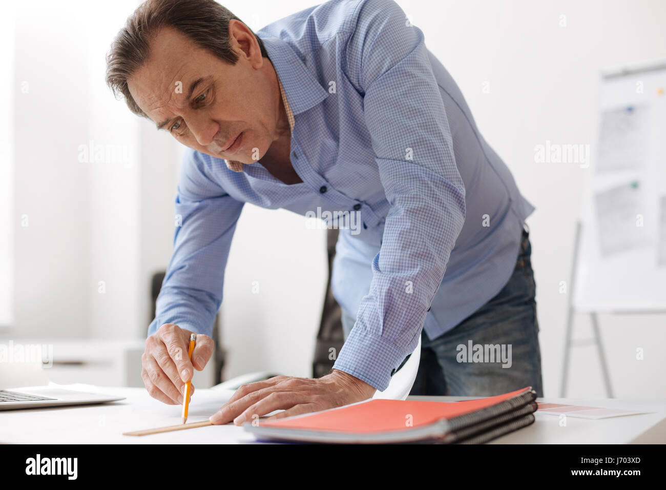 Professional engineer drawing blueprint Stock Photo - Alamy