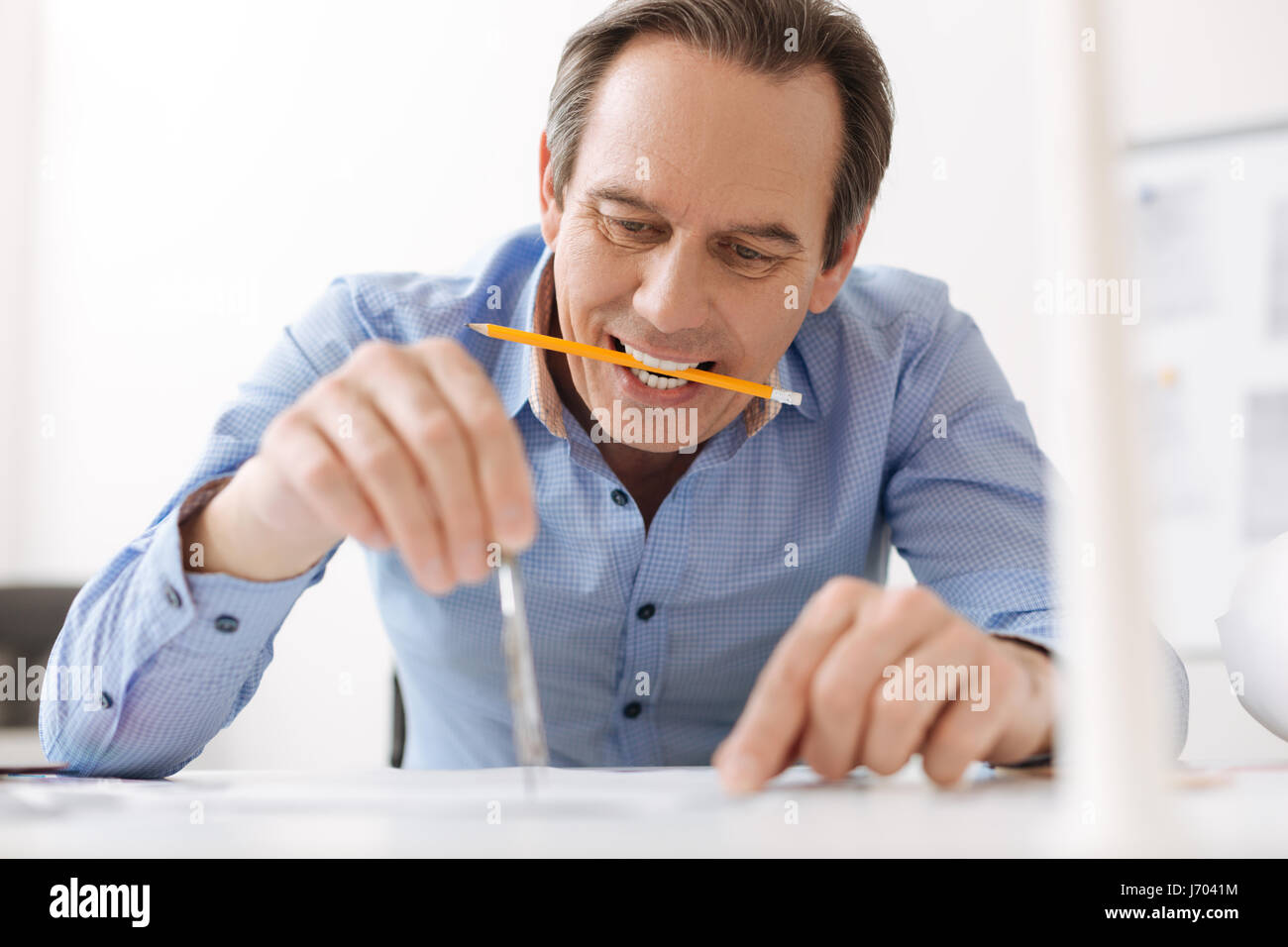 Professional engineer drawing a blueprint Stock Photo - Alamy