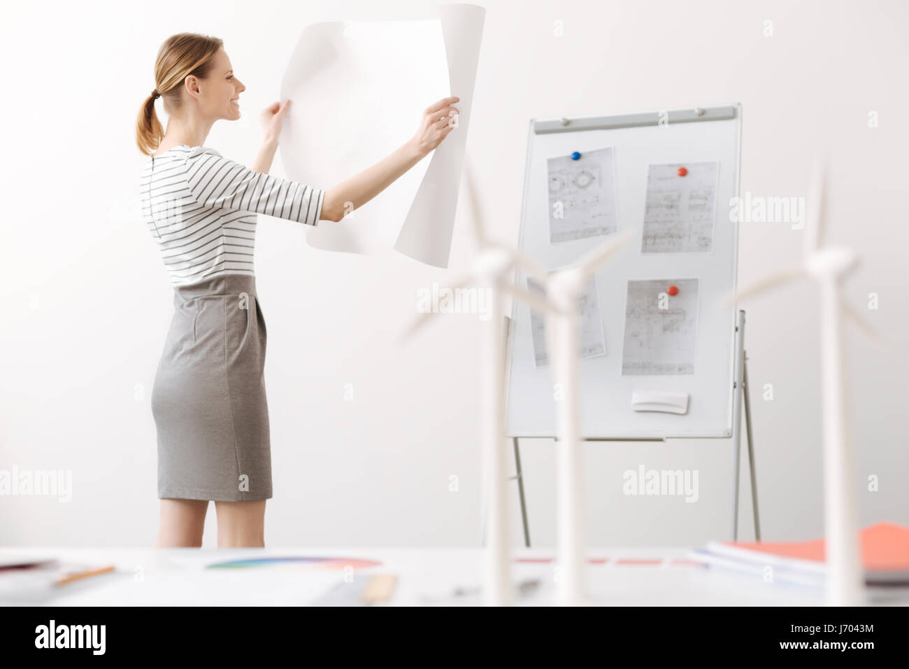 Female engineer holding plan hi-res stock photography and images - Alamy