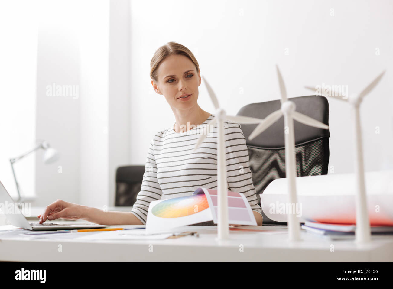 Concentrated female engineer working in the office Stock Photo - Alamy