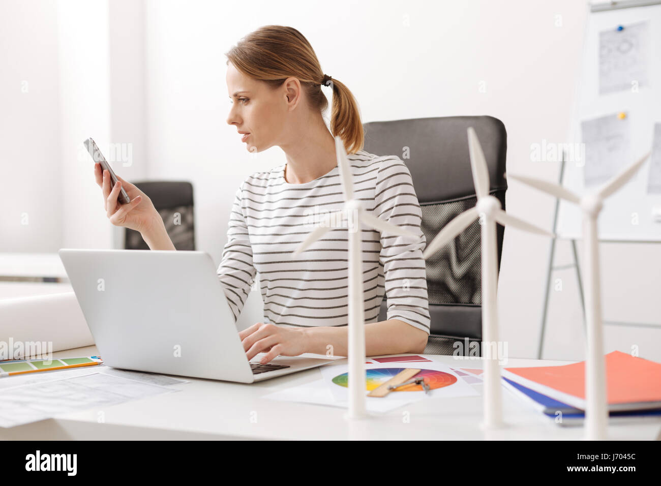 Professional female engineer making a call Stock Photo - Alamy