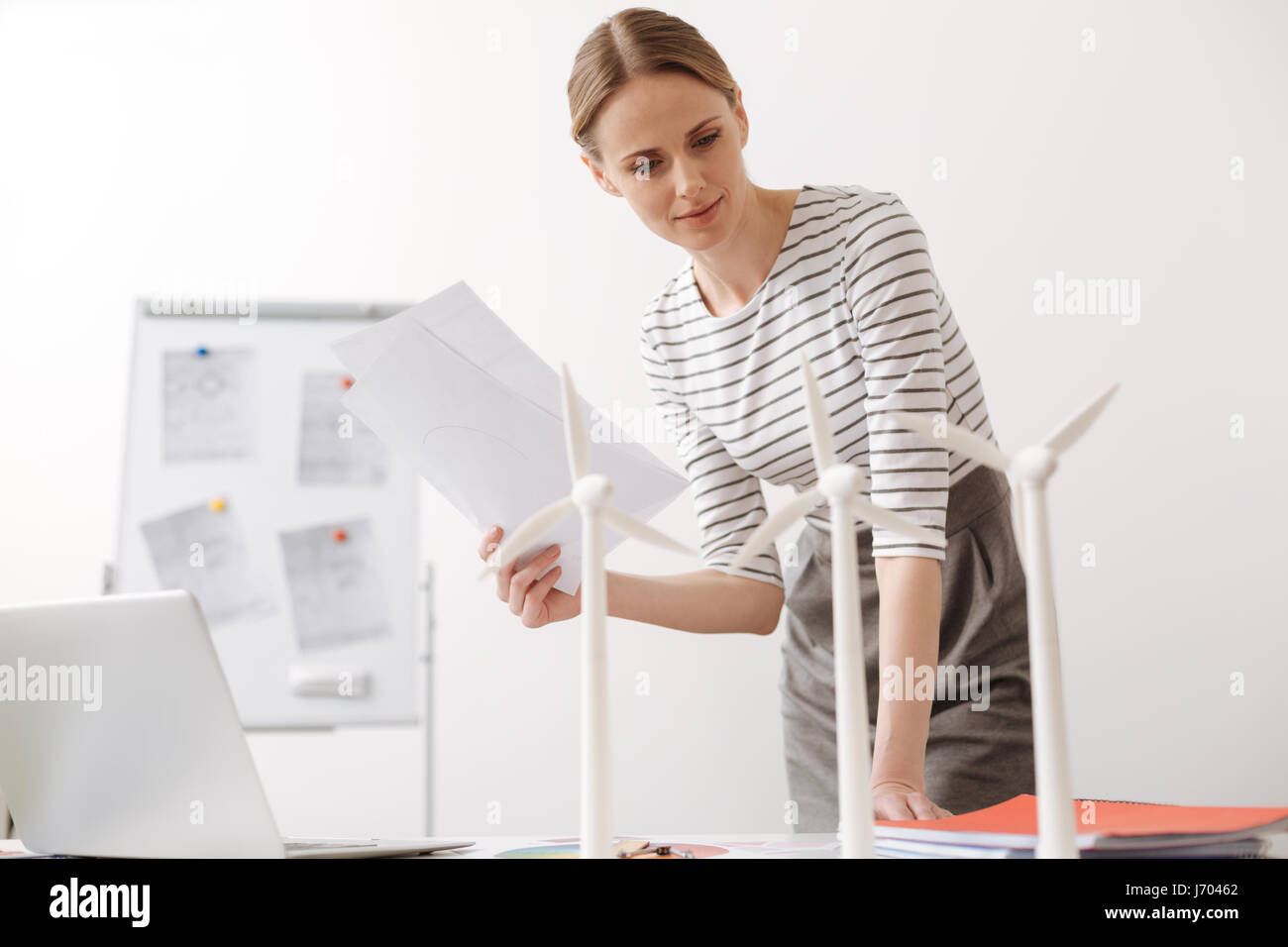 Concentrated female engineer working on the eco project Stock Photo - Alamy