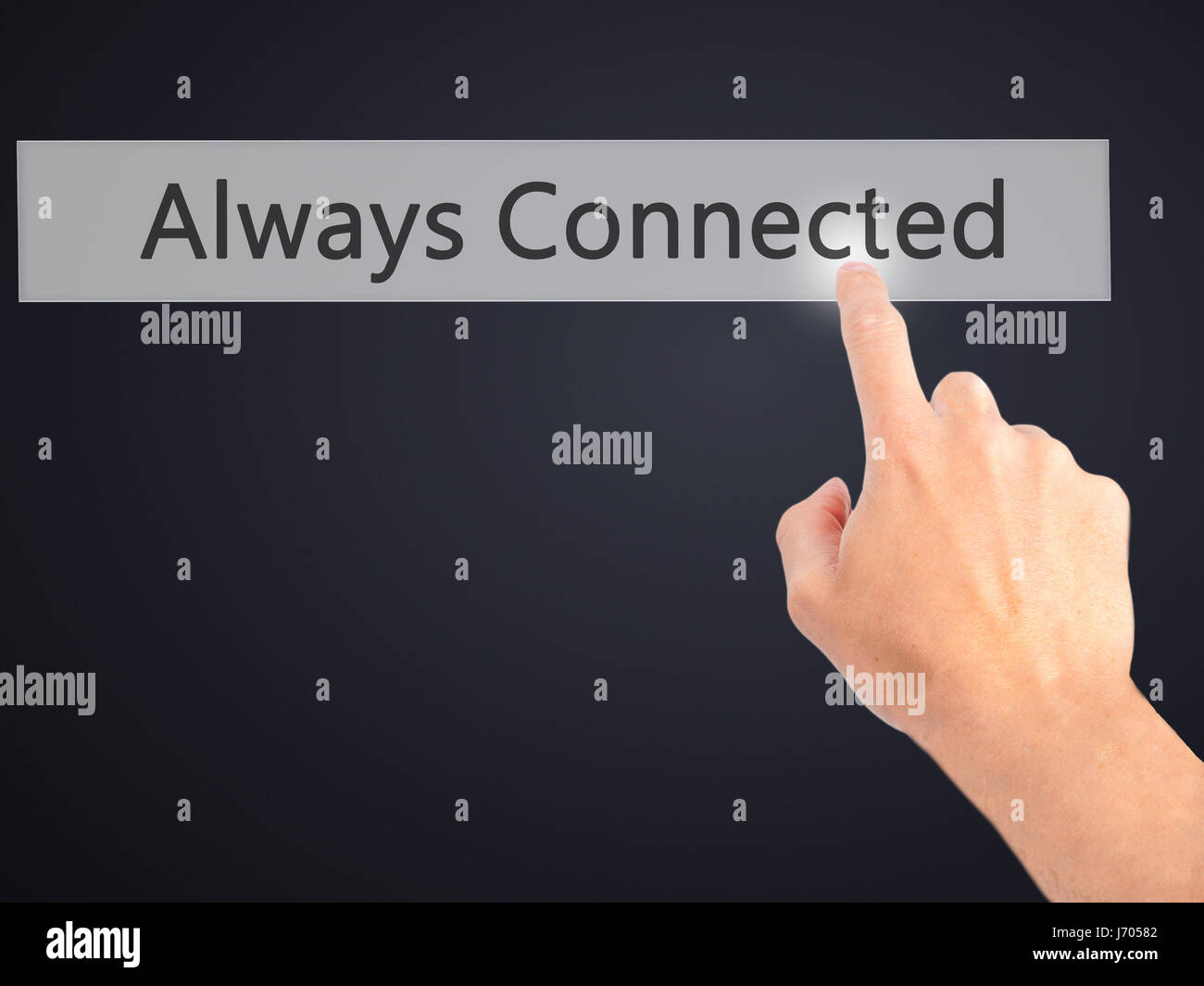 Always Connected- Hand pressing a button on blurred background concept ...