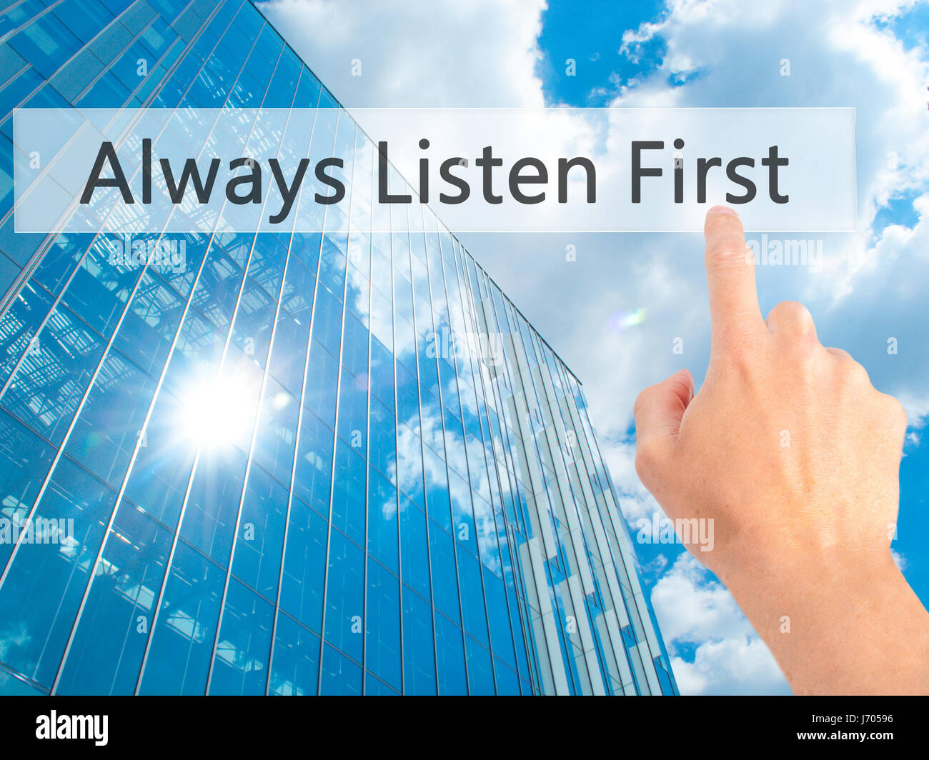 Always Listen First - Hand pressing a button on blurred background ...