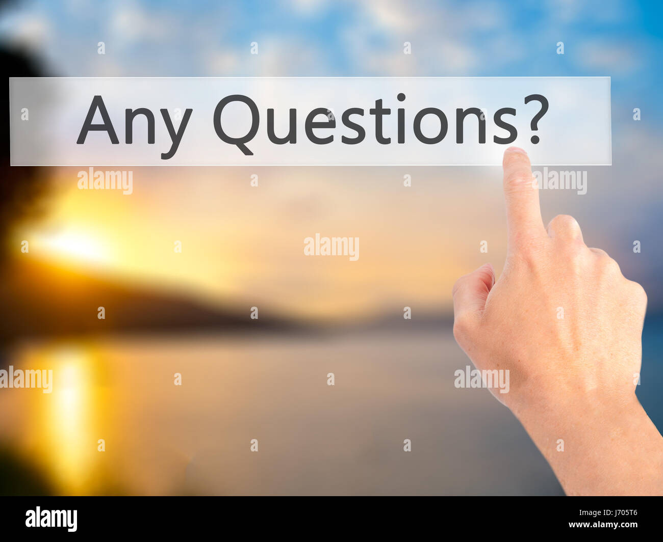 Any Questions - Hand pressing a button on blurred background concept ...