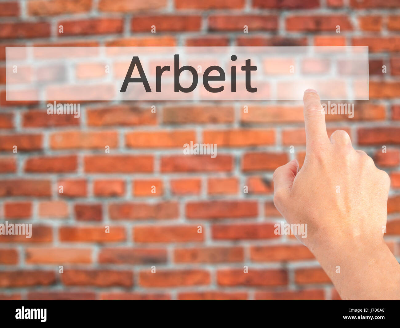 Arbeit (Work in German) - Hand pressing a button on blurred background ...