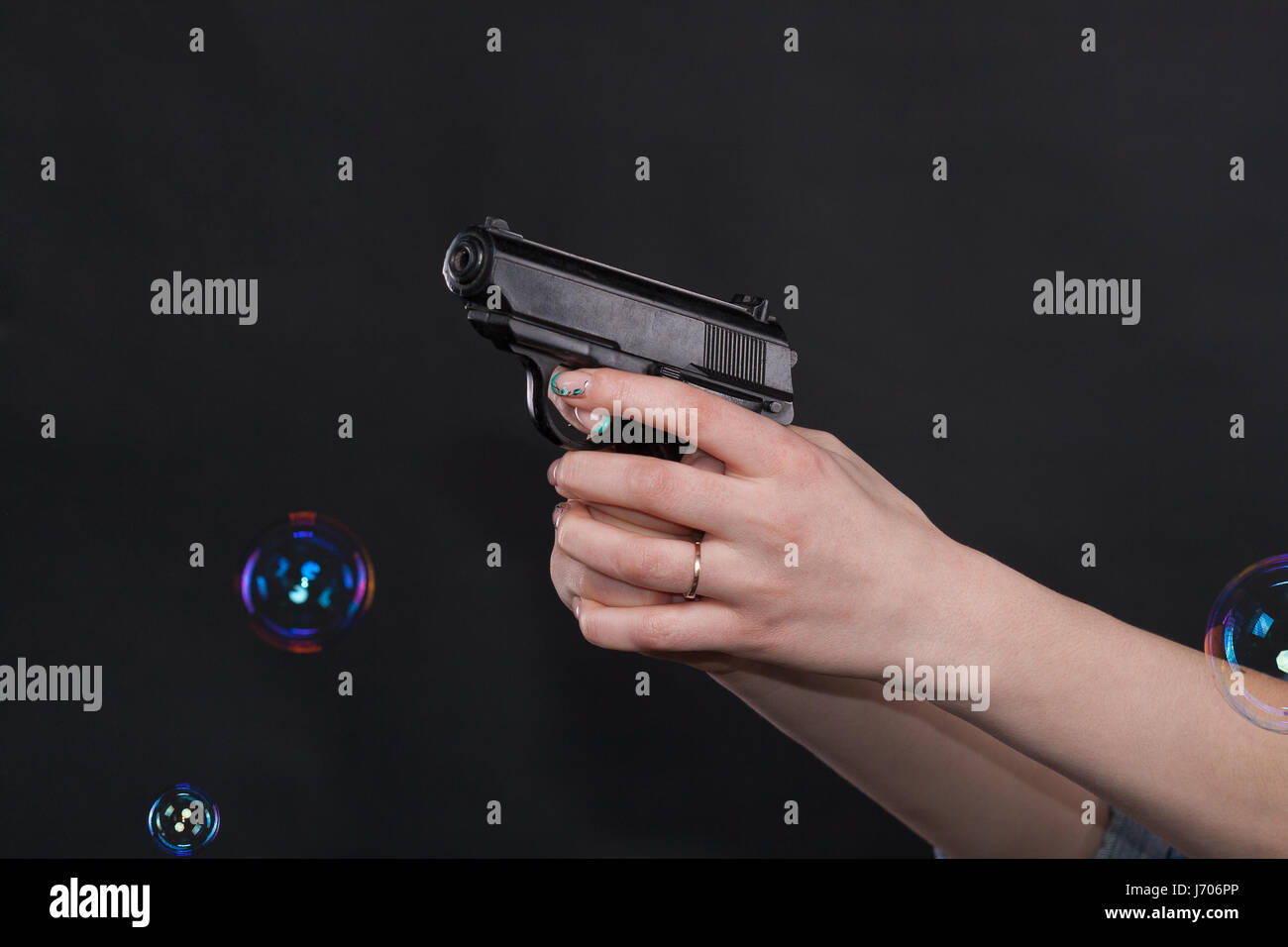 Woman holding gun her hand hi-res stock photography and images - Alamy
