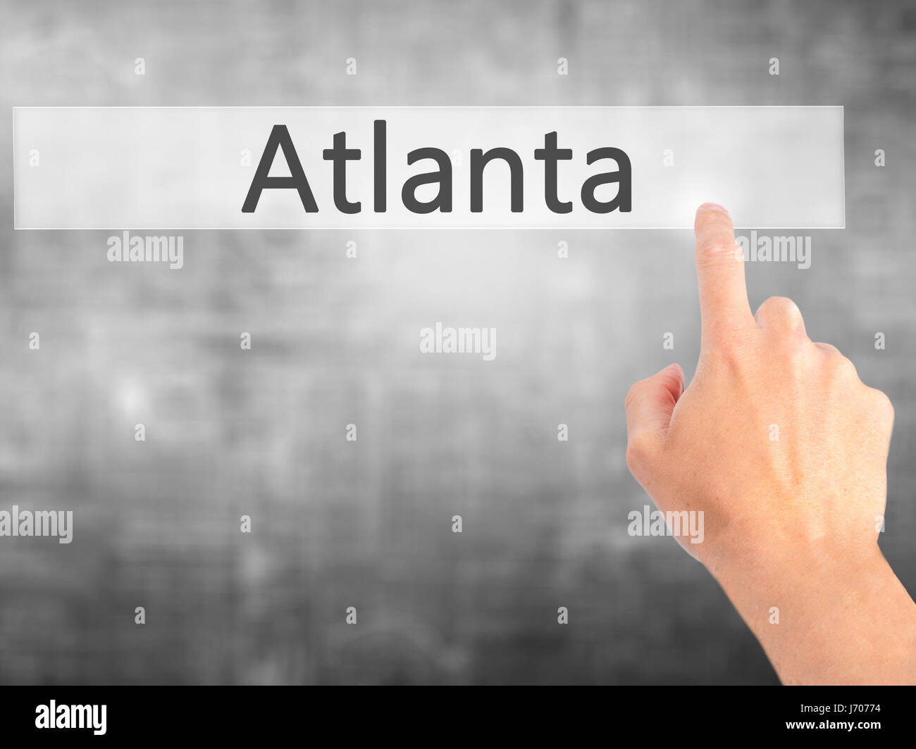 Atlanta - Hand pressing a button on blurred background concept ...