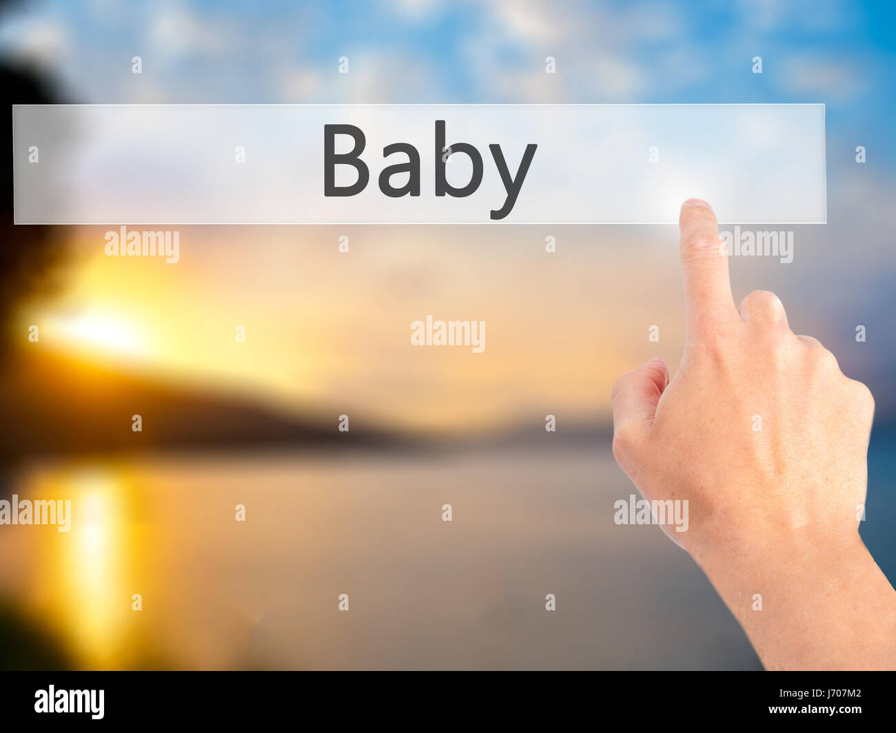 Baby - Hand pressing a button on blurred background concept . Business ...