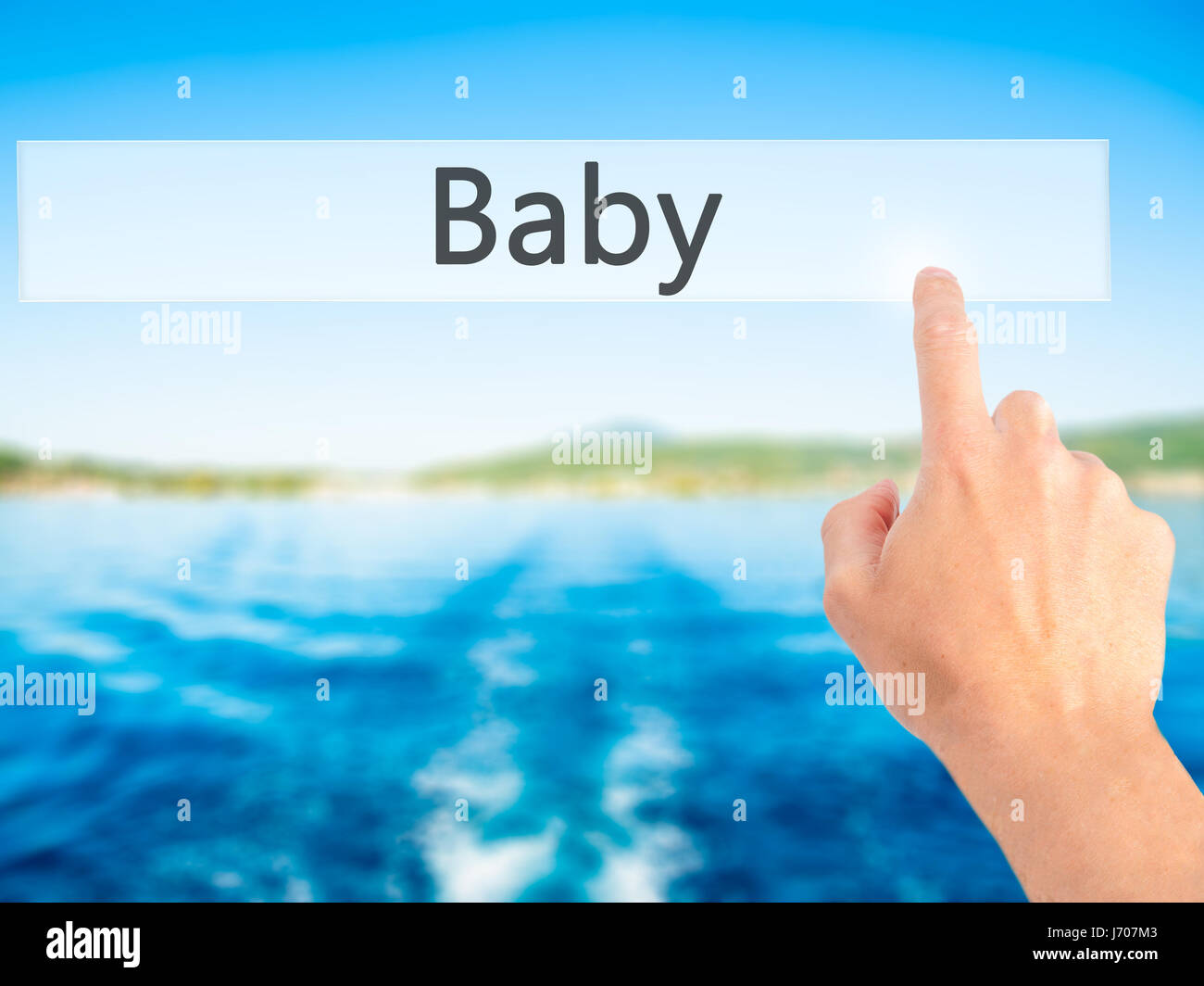Baby - Hand pressing a button on blurred background concept . Business ...