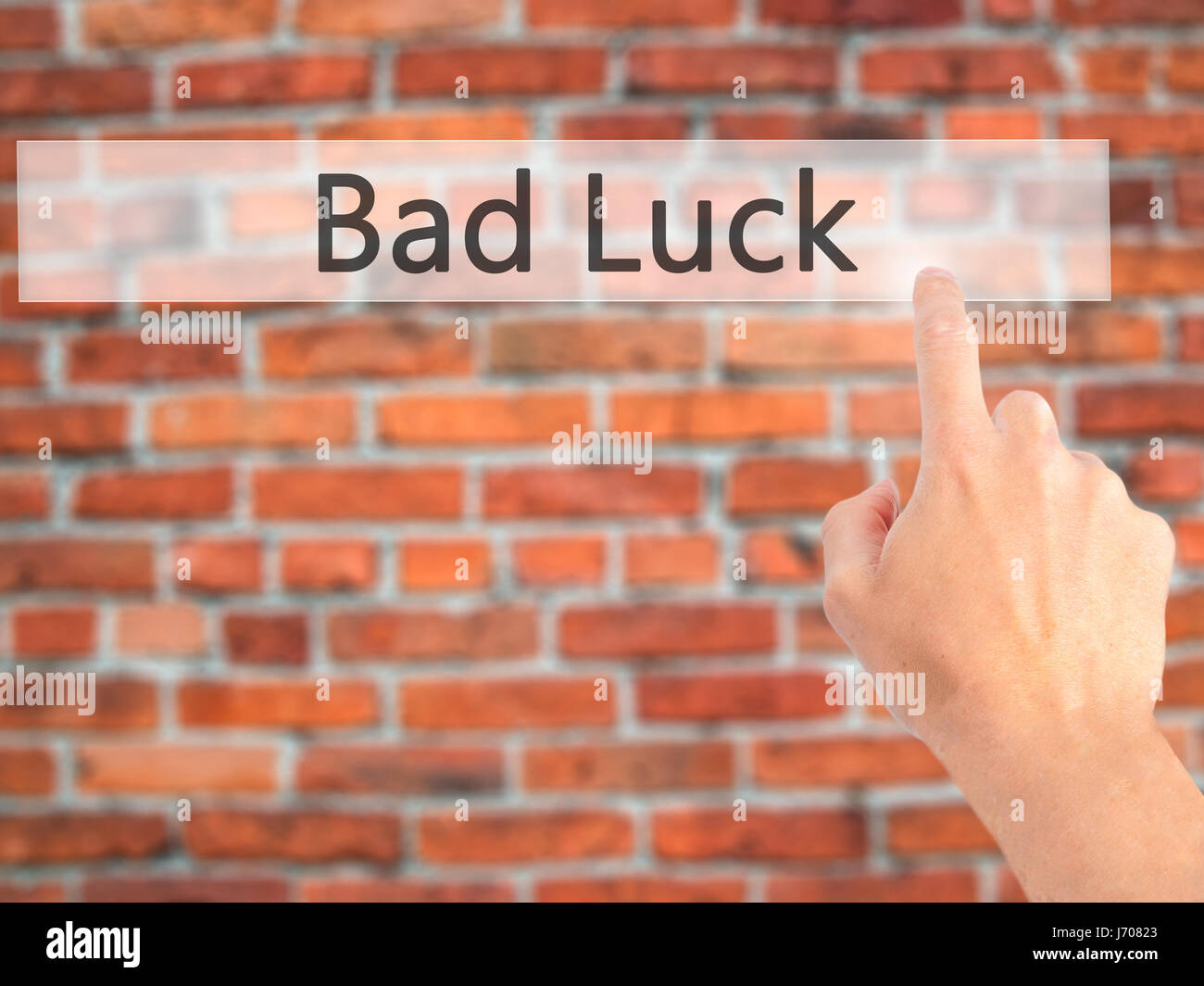 Bad Luck - Hand pressing a button on blurred background concept ...