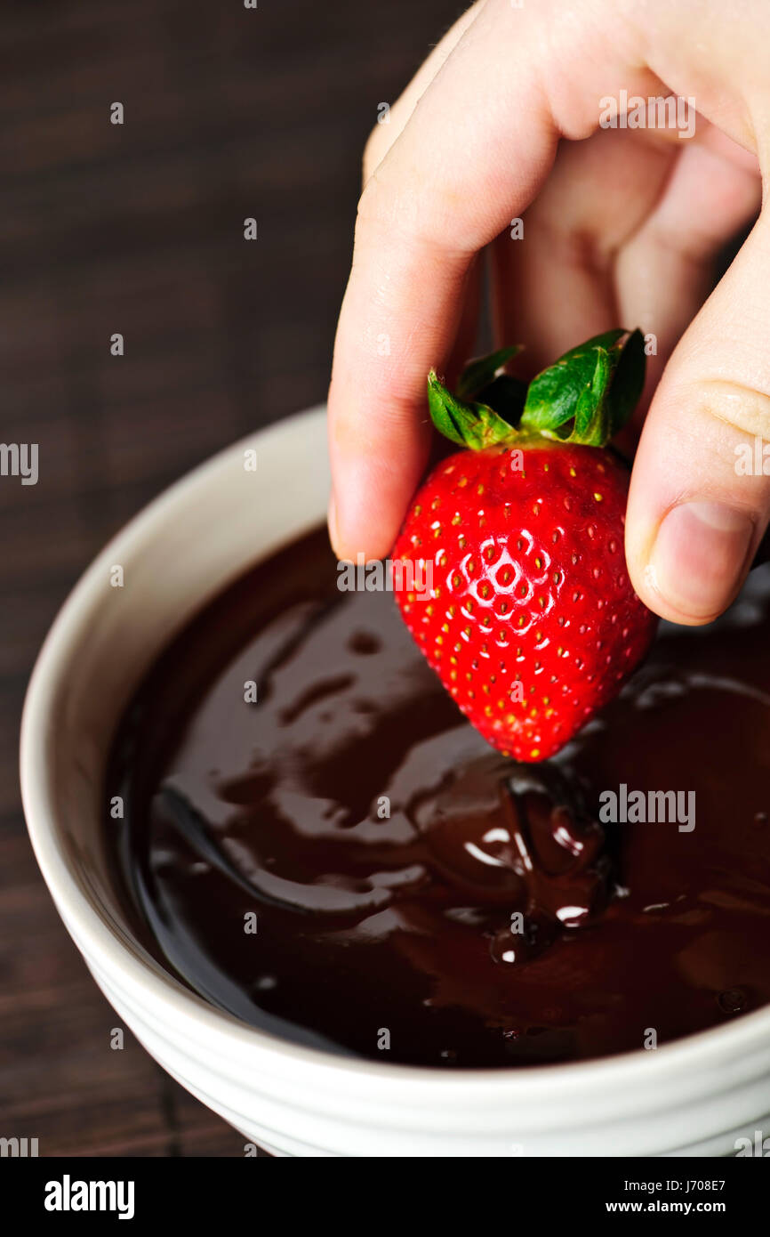 hand sweet strawberry melted melt dessert chocolate close food aliment ...