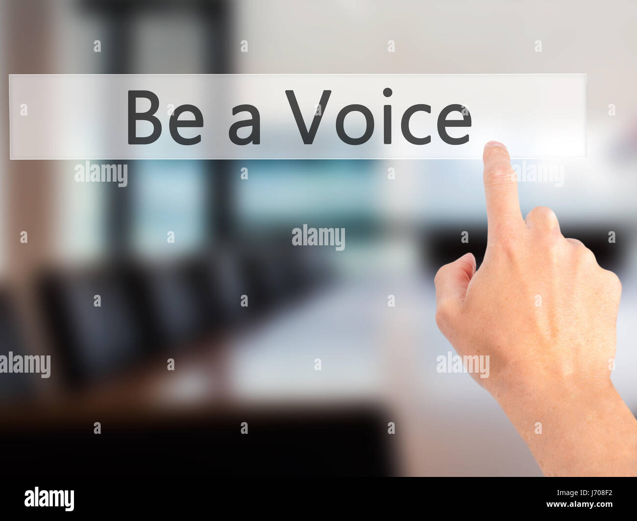 Be a Voice - Hand pressing a button on blurred background concept ...