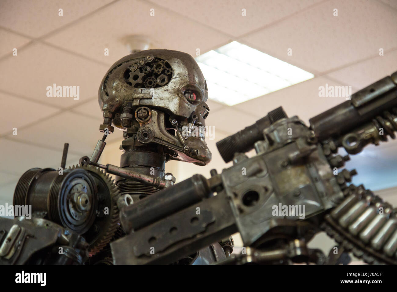 Robot (metal) assassin with automatic weapon Stock Photo - Alamy