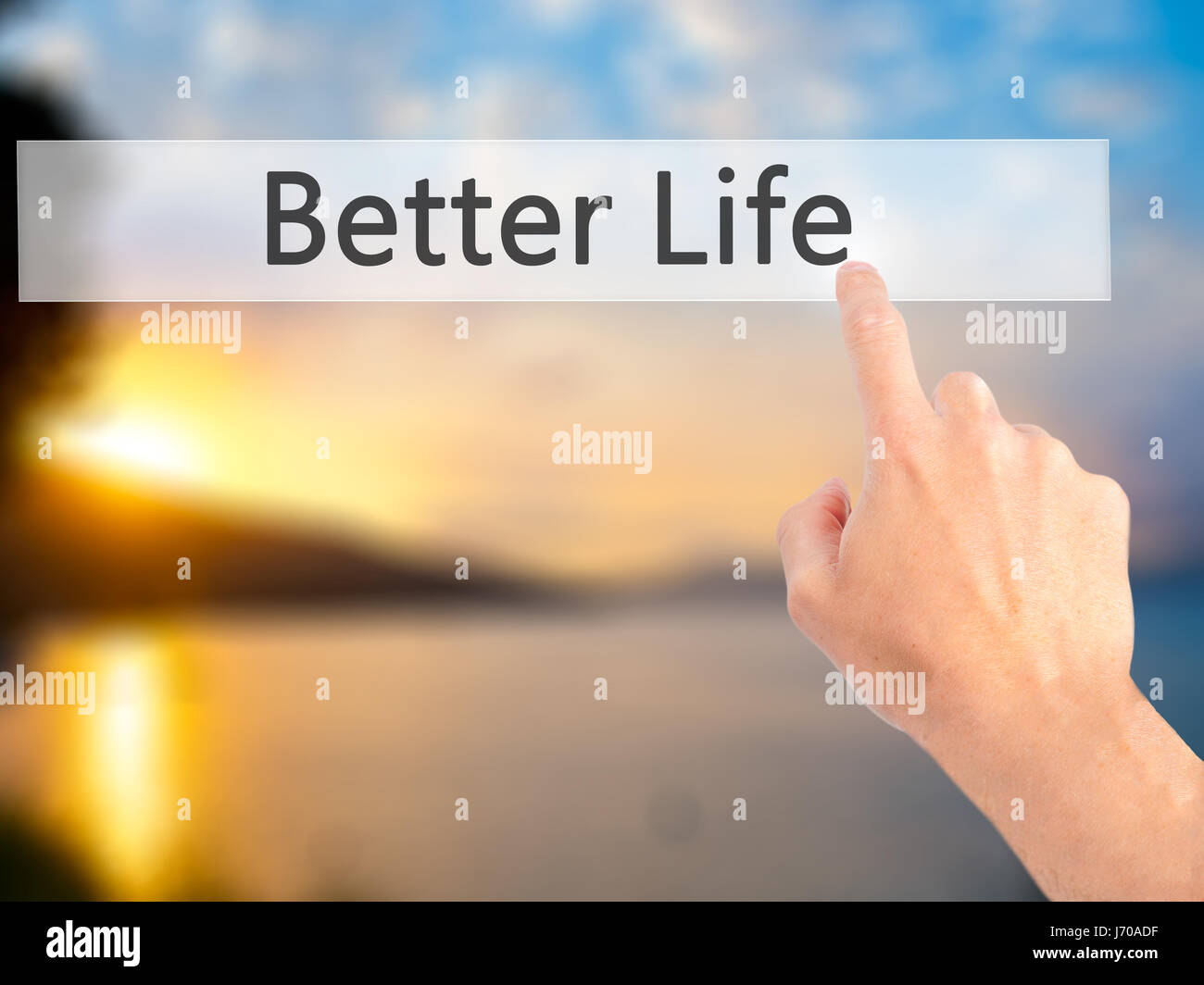 Better Life - Hand pressing a button on blurred background concept ...