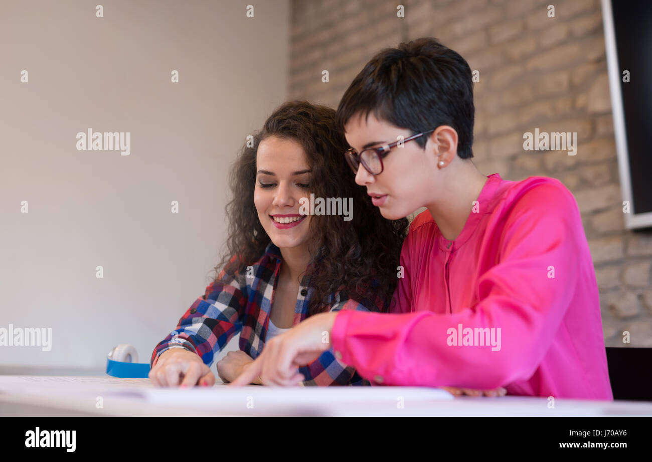 Group of young colleagues working together in office Stock Photo - Alamy