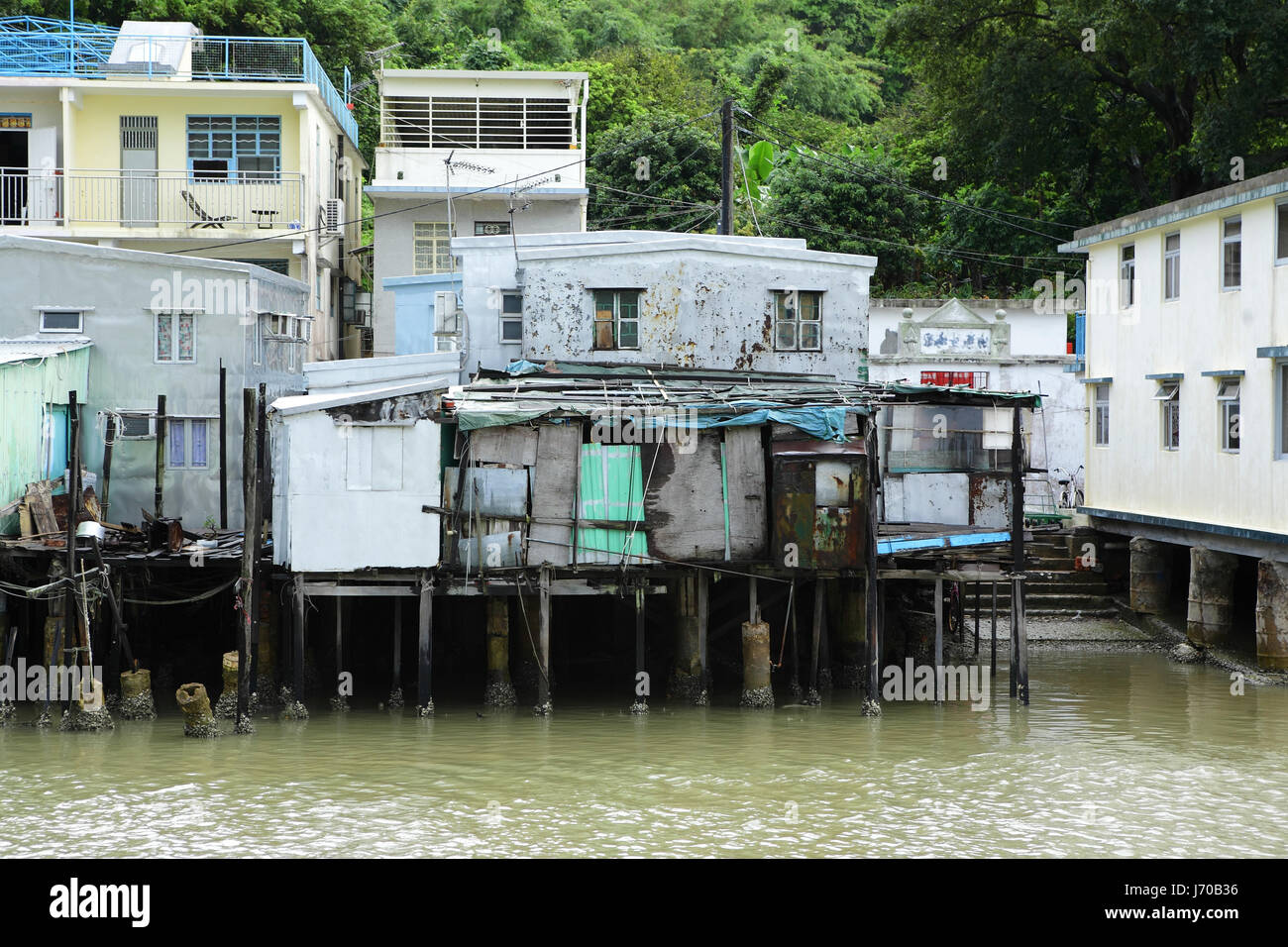 house building fishing stilt community village market town blue house ...